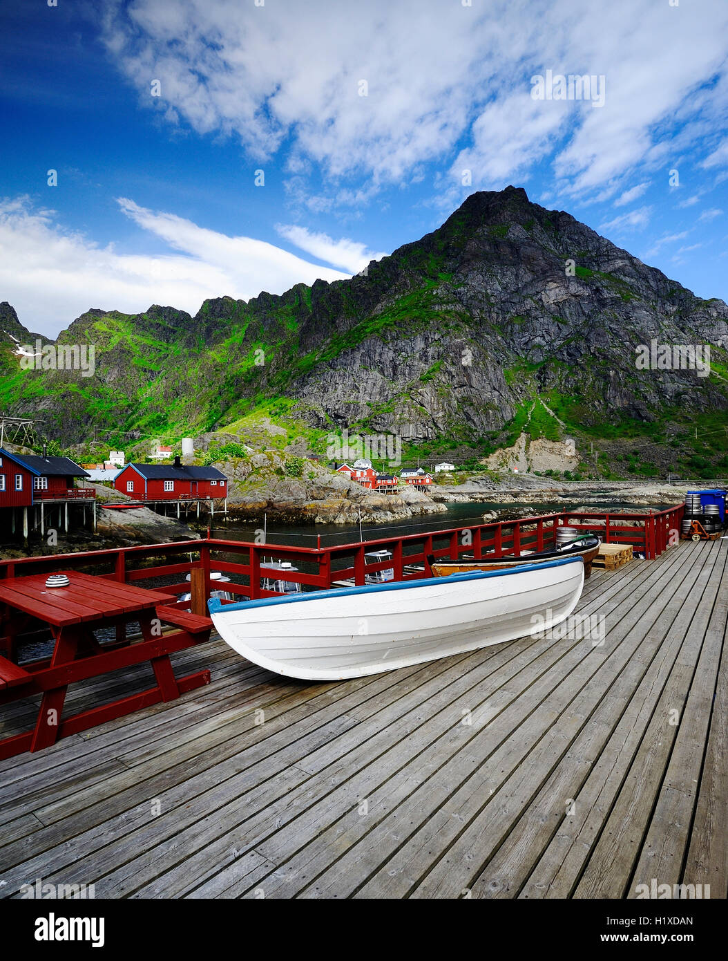 Houses on stilts and the fishing boat in the Lofoten islands Stock ...