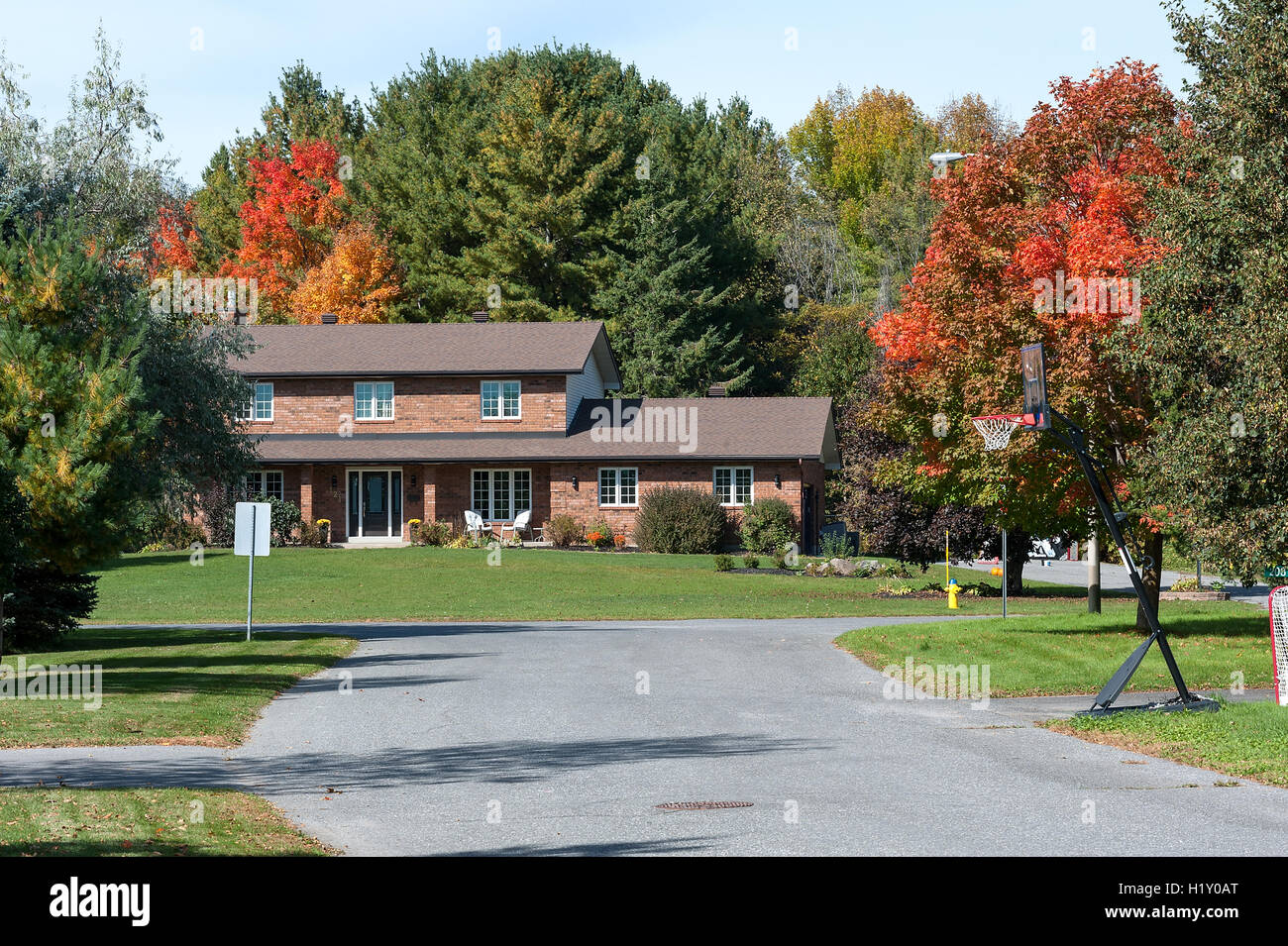 brick house in fall colors Stock Photo - Alamy