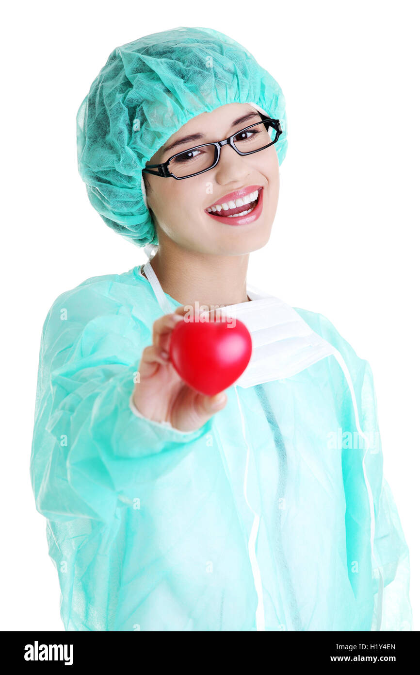 Smiling female doctor or nurse holding heart Stock Photo - Alamy