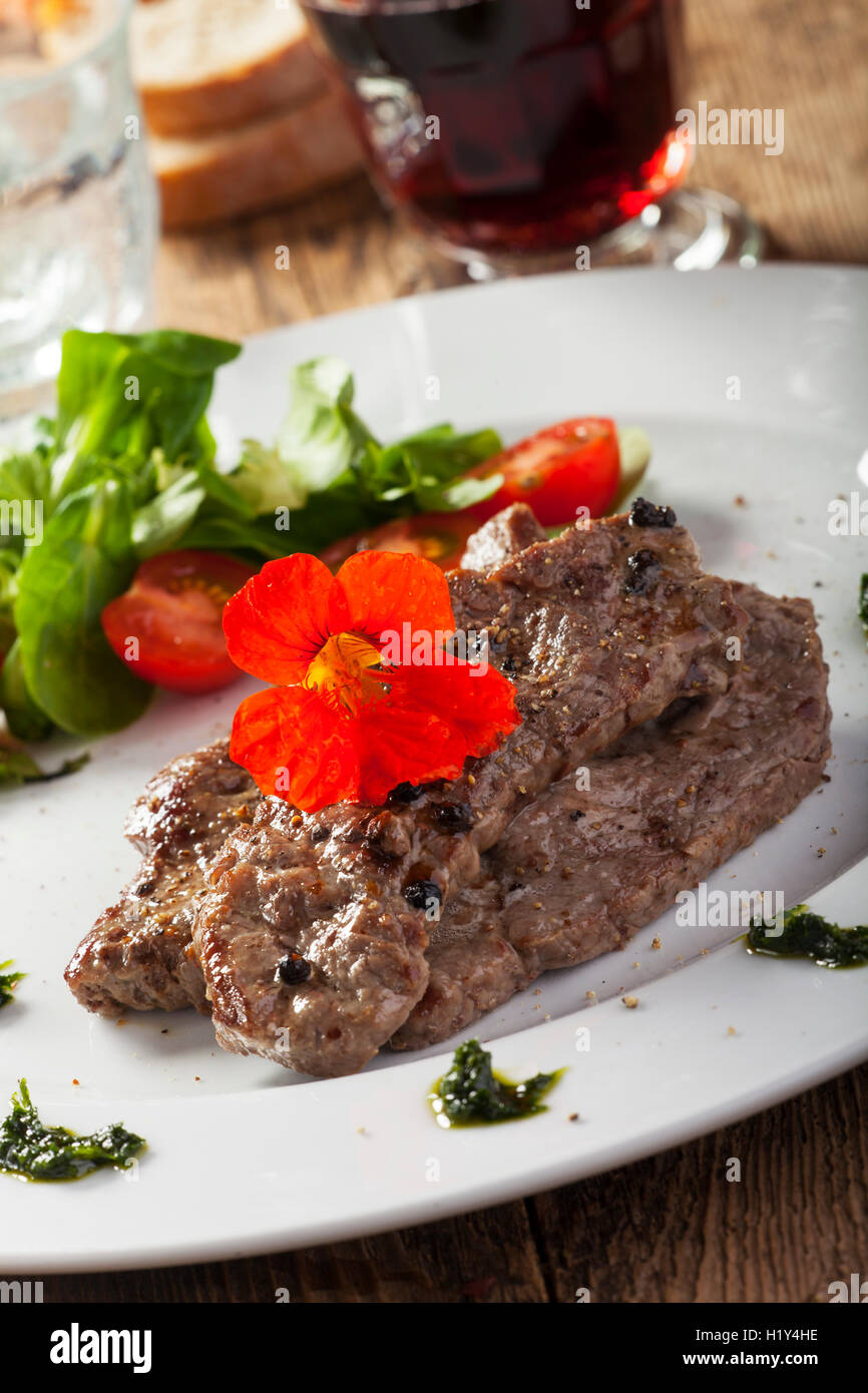 grilled steak with indian cress flower Stock Photo - Alamy