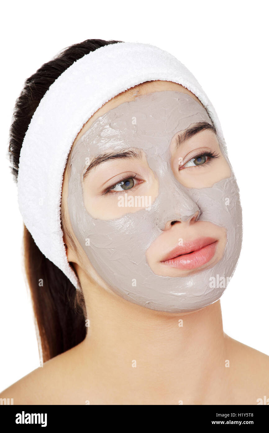 Beautiful woman with clay facial mask Stock Photo - Alamy