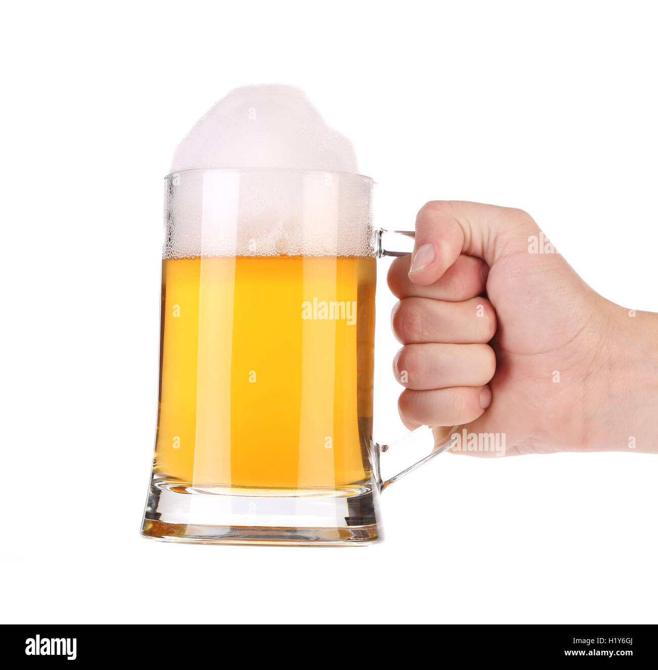 Mug of beer with foam in hand Stock Photo - Alamy