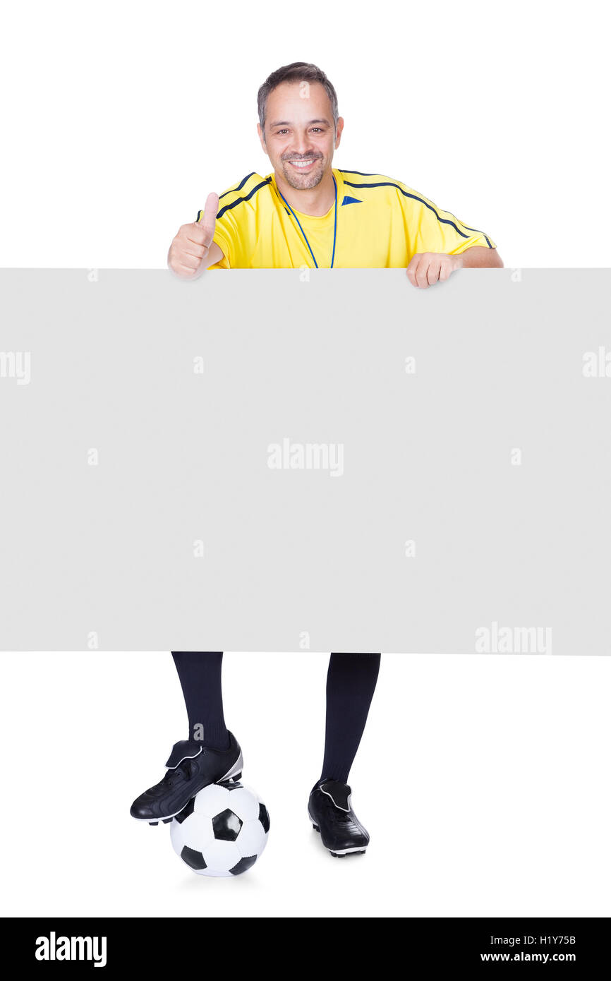 Happy Coach Holding Placard And Football Stock Photo - Alamy