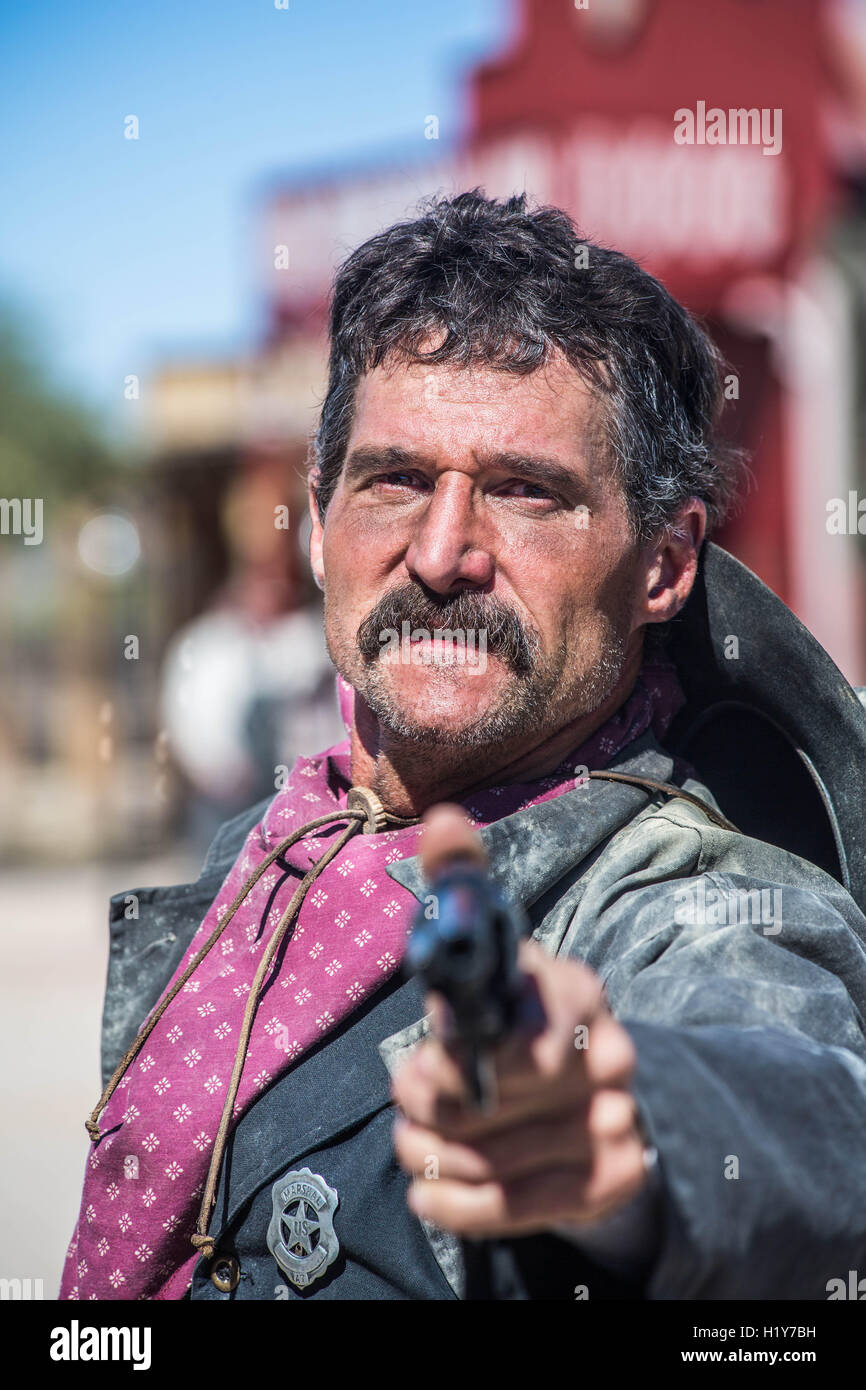 Stern Cowboy Points gun Stock Photo - Alamy