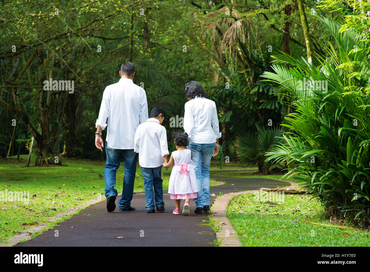 Happy Indian family walking outdoor Stock Photo - Alamy
