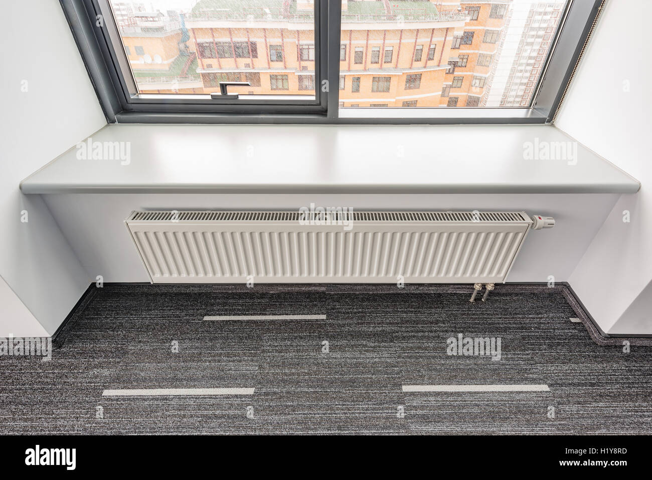 White radiator in the office at rainy day time Stock Photo - Alamy