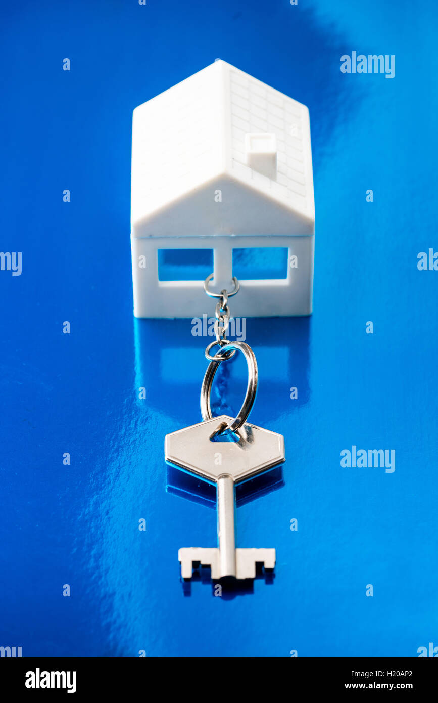 Key attached to a house Stock Photo - Alamy