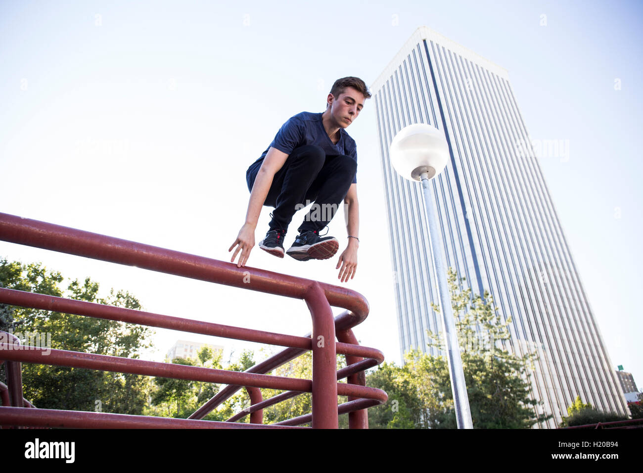 Man jumping over fence in city hi-res stock photography and images - Alamy