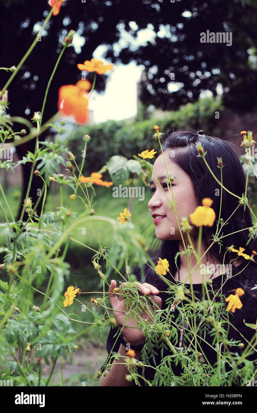 Girl Hiding Face With Flower