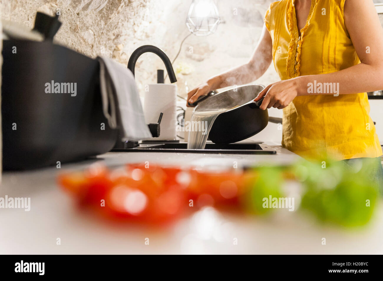 Woman in kitchen preparing spaghetti Stock Photo - Alamy