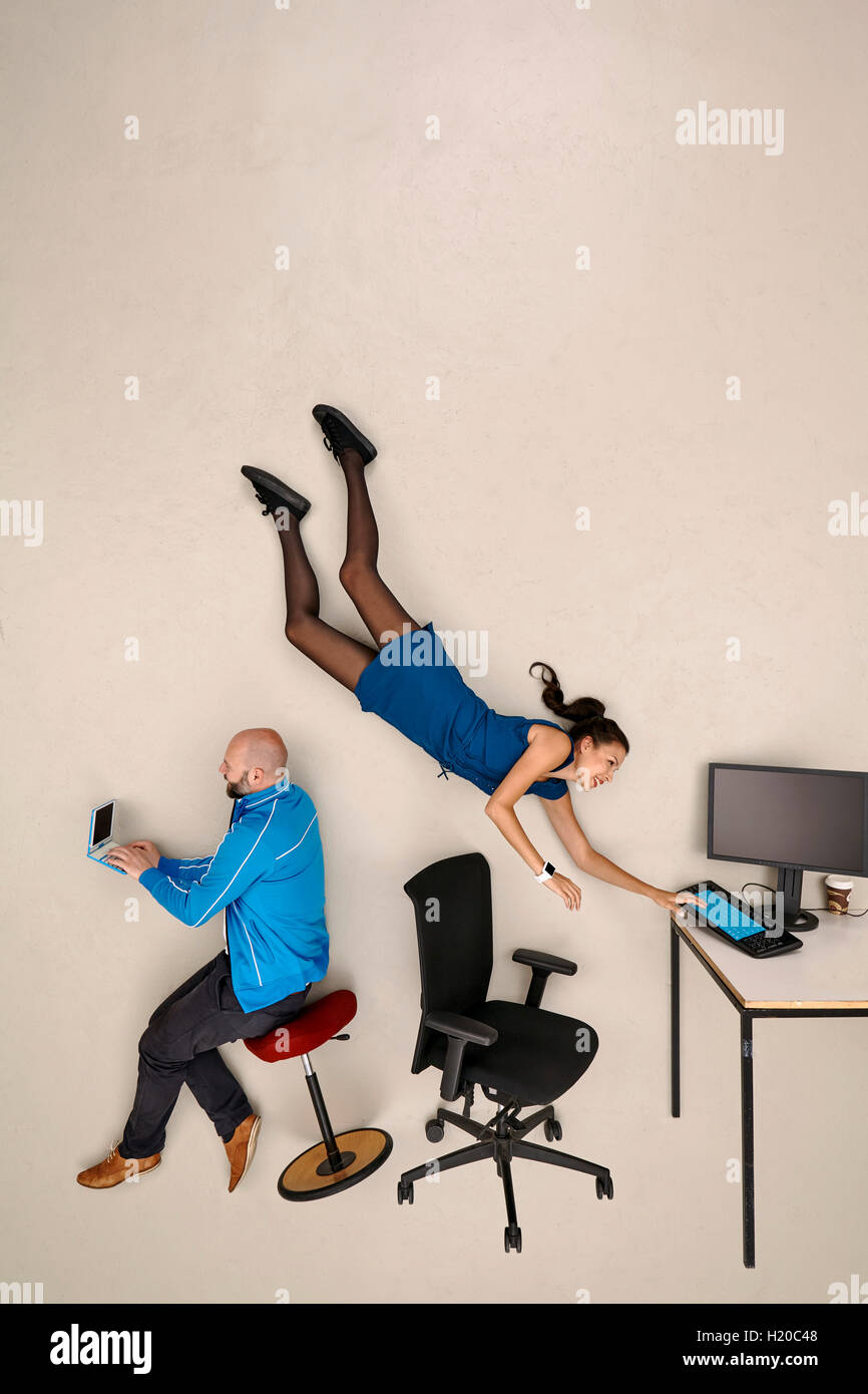 Business woman flying towards office desk hi-res stock photography and ...