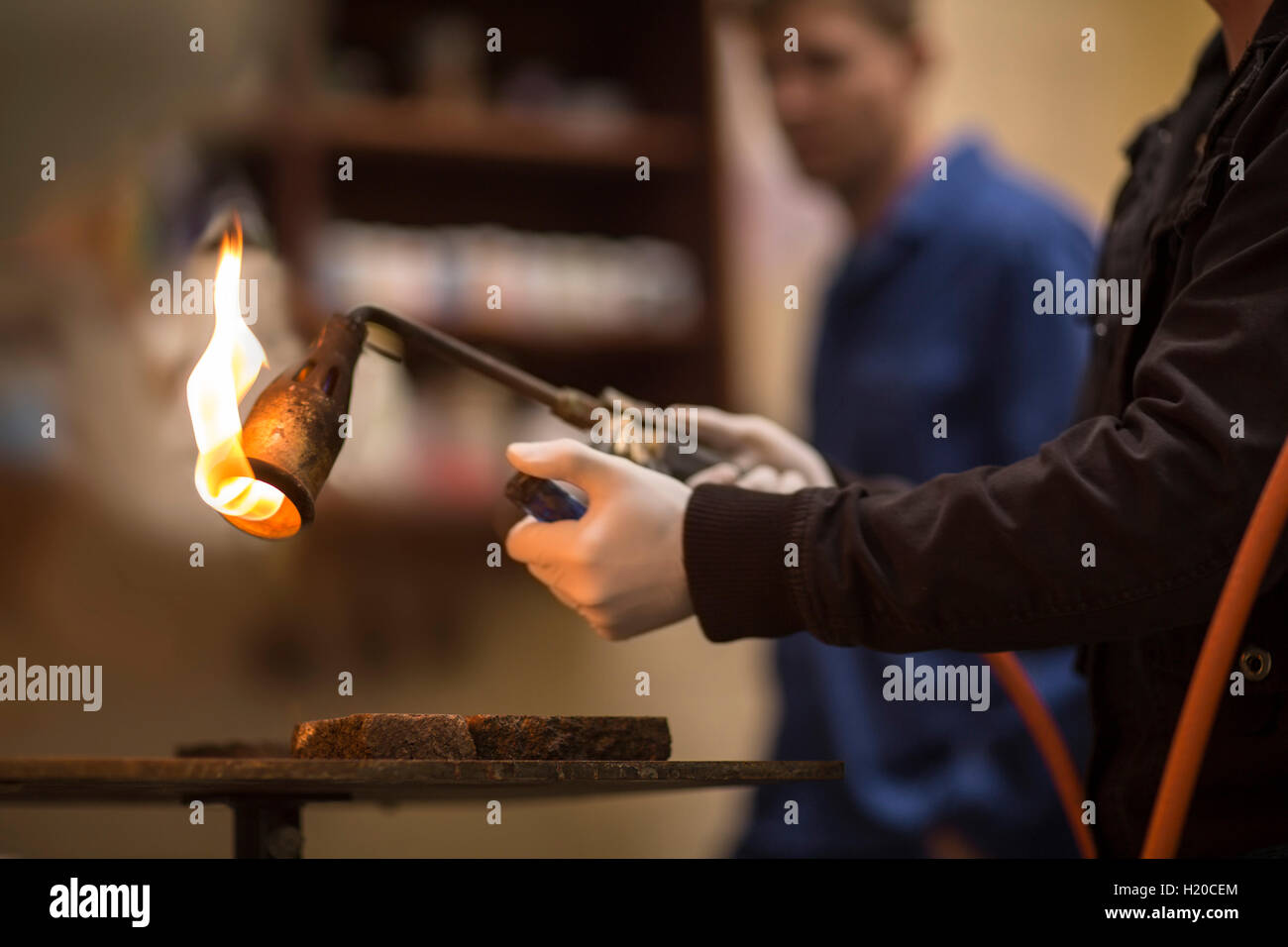 Man holding welding torch Stock Photo - Alamy