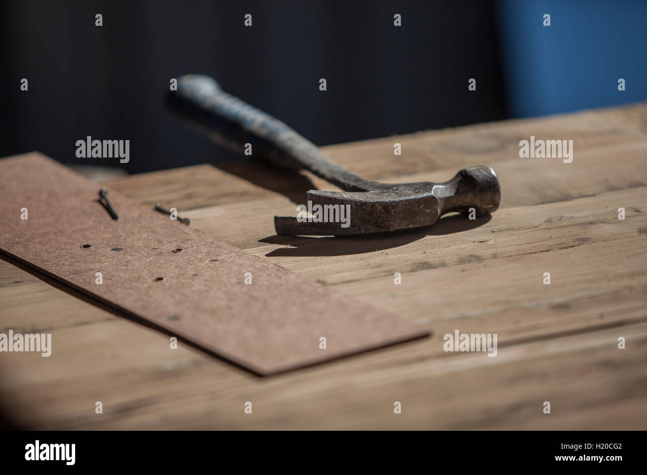 Hammer on workbench Stock Photo - Alamy