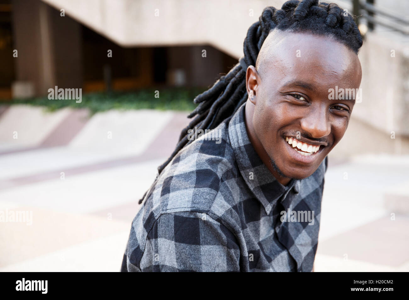 Young black man with dreadlocks, portrait Stock Photo - Alamy