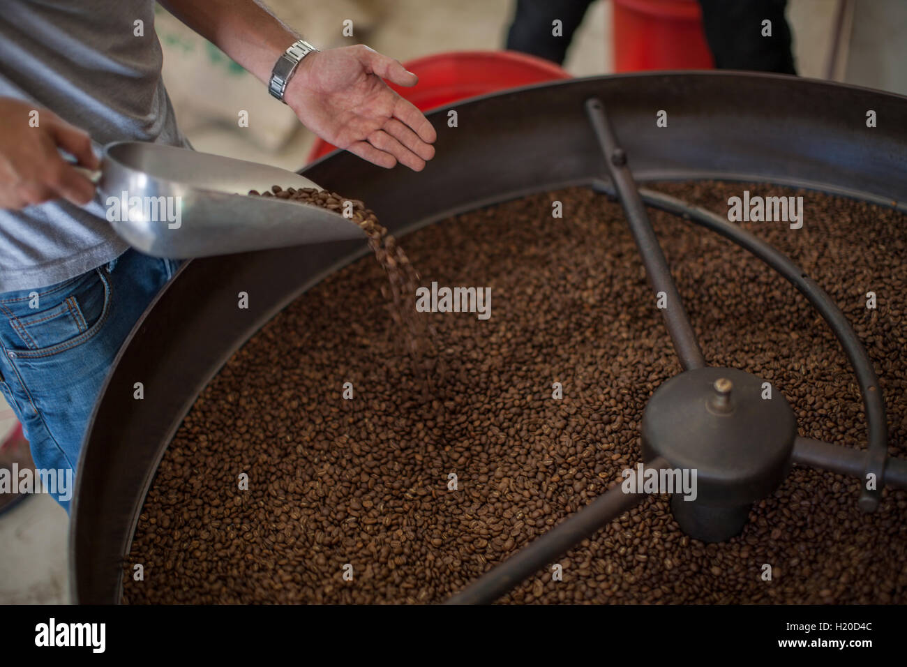 Rasted coffee beans in cooling cylinder Stock Photo - Alamy