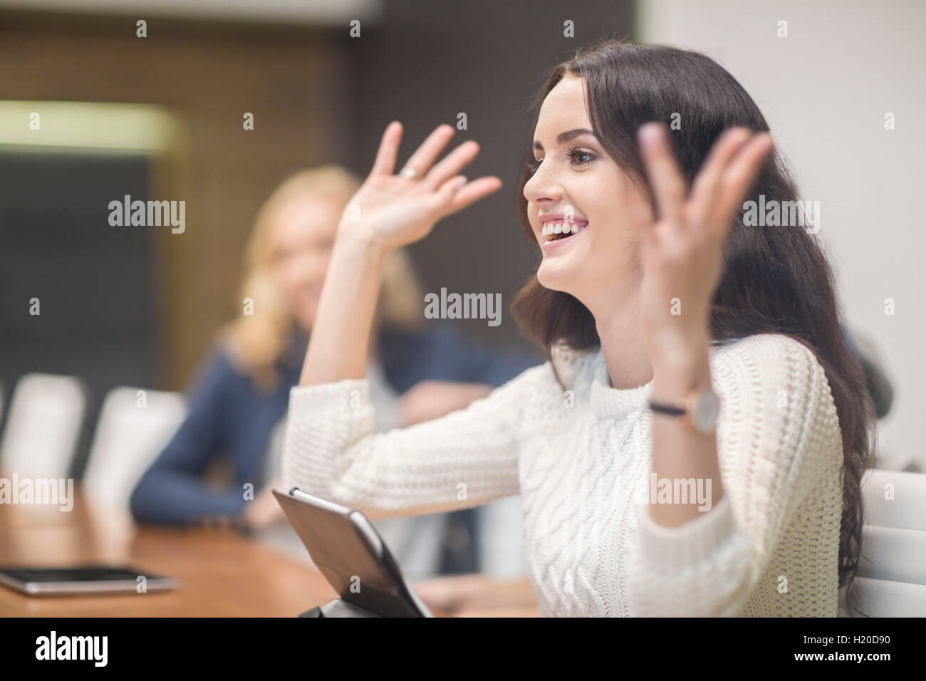Young people discussing in business meeting Stock Photo - Alamy