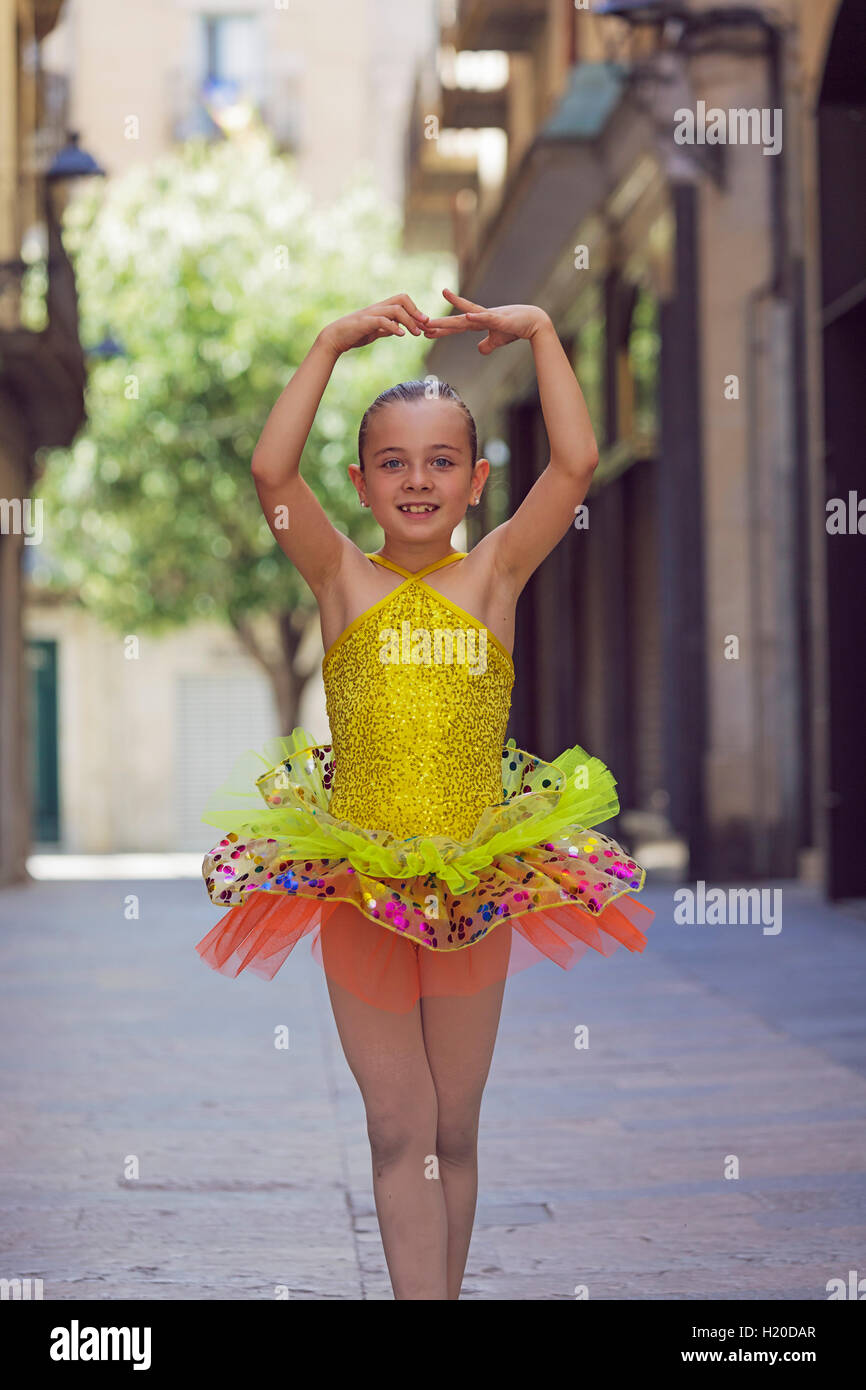 Smiling girl posing in colourful ballet dress Stock Photo - Alamy