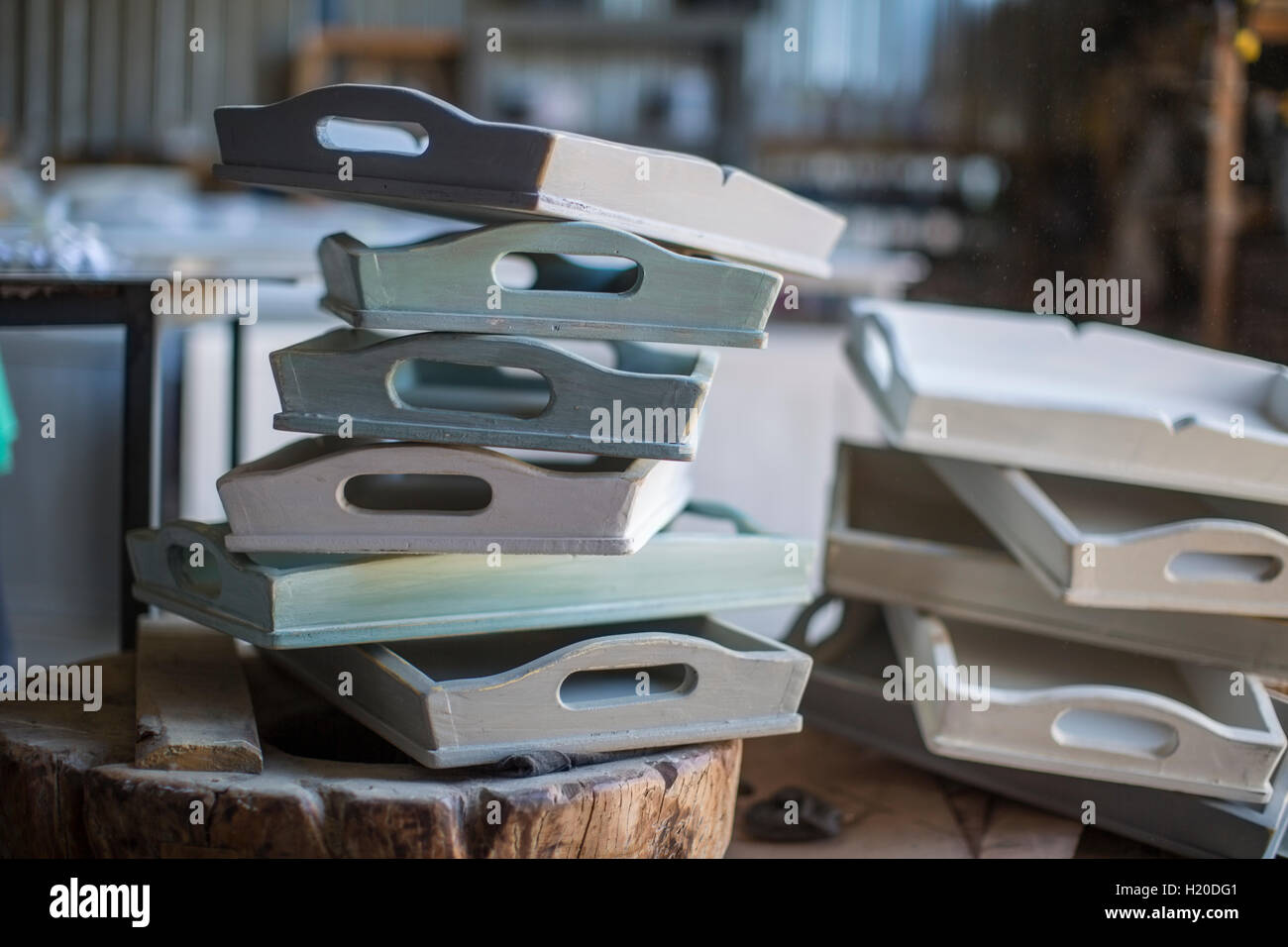 Stack of wooden trays in workshop Stock Photo - Alamy