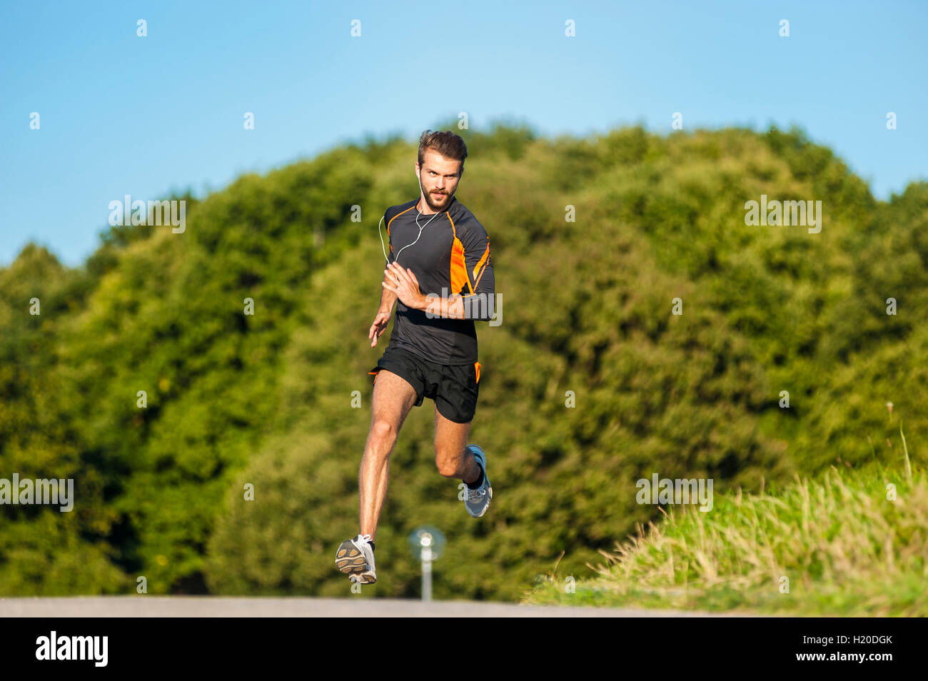 Man running on rural path Stock Photo - Alamy