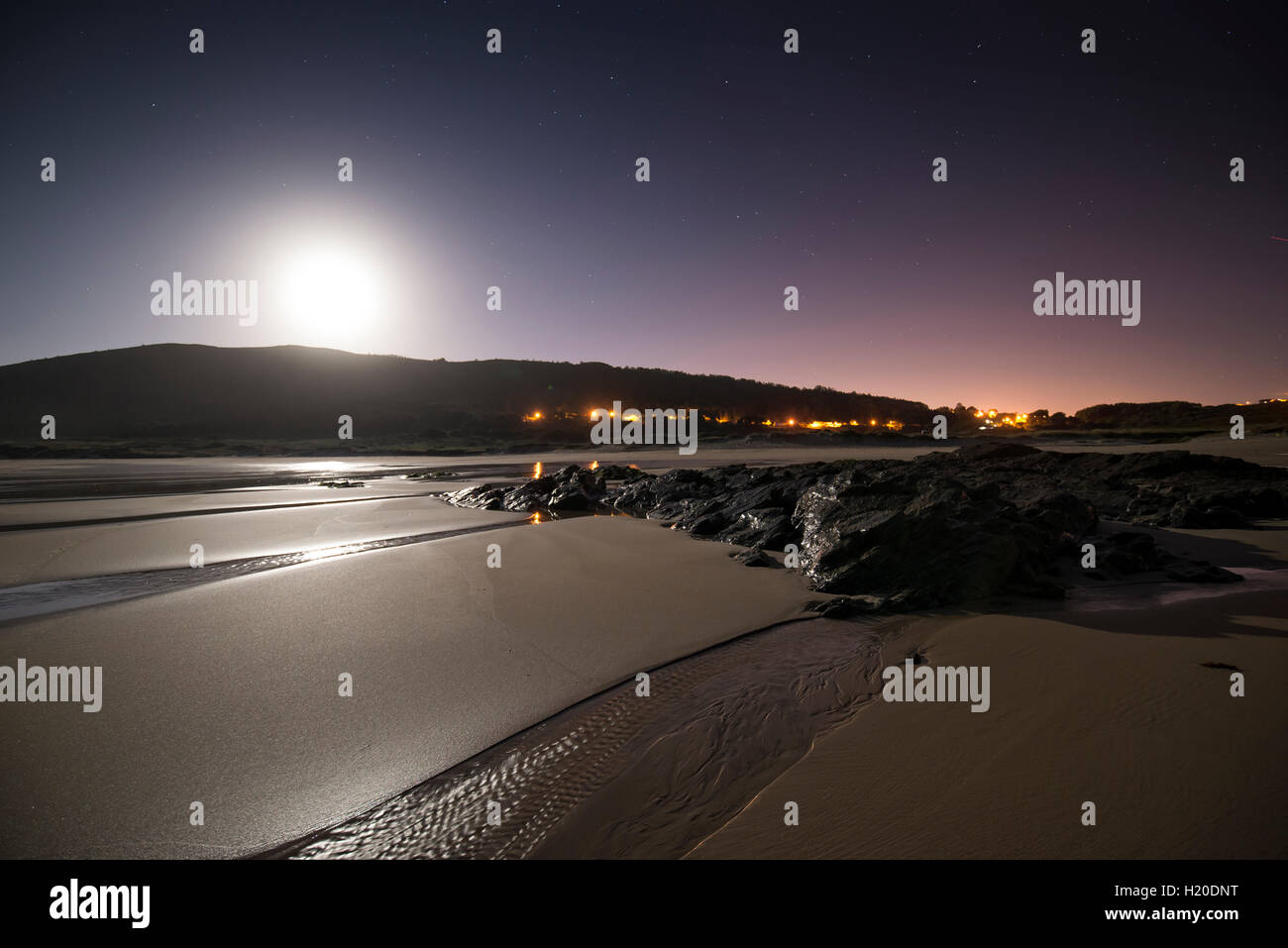 Spain, Galicia, Ferrol, Beach at night with full moon Stock Photo - Alamy