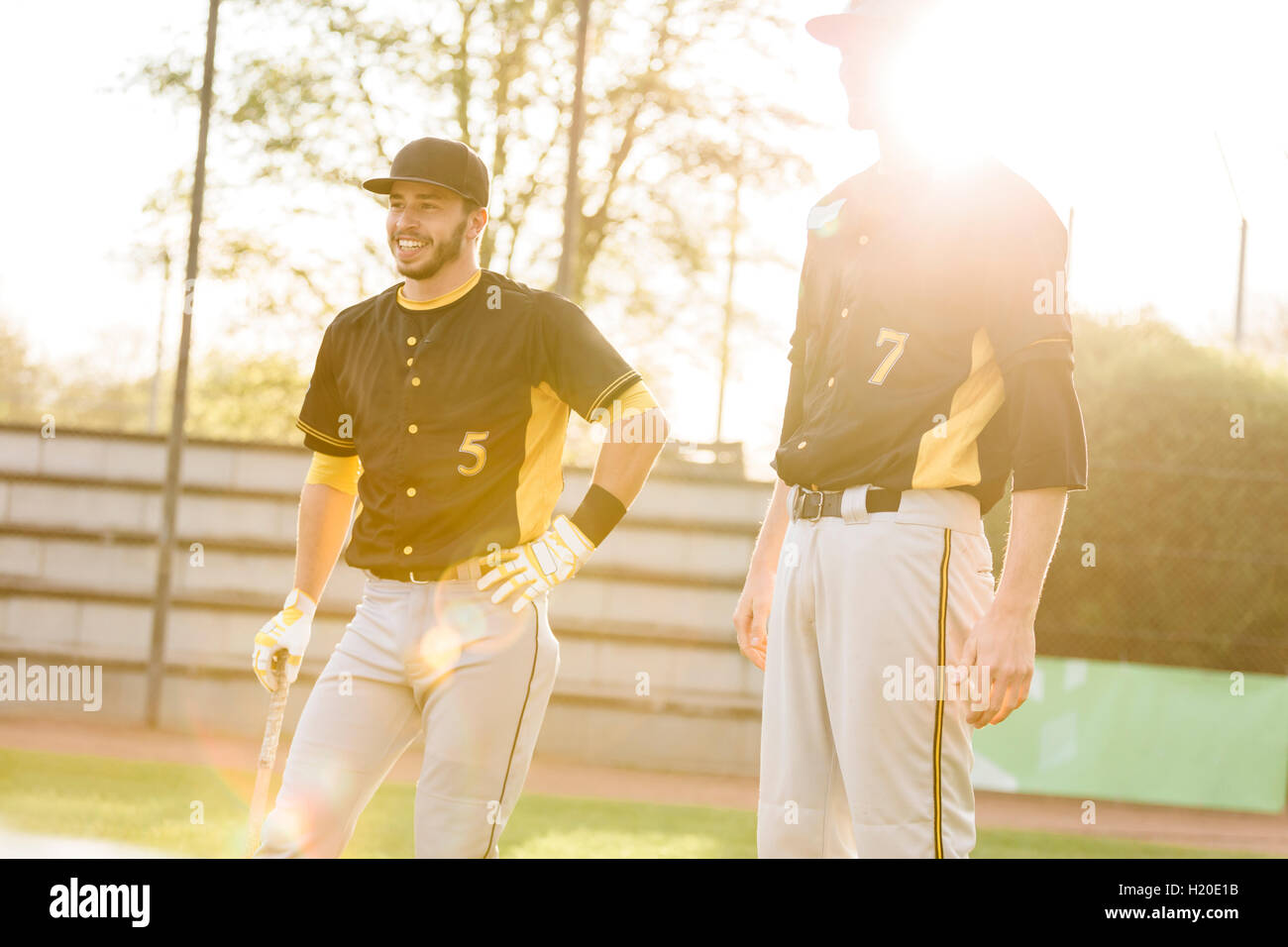 Two smiling baseball players on field Stock Photo - Alamy