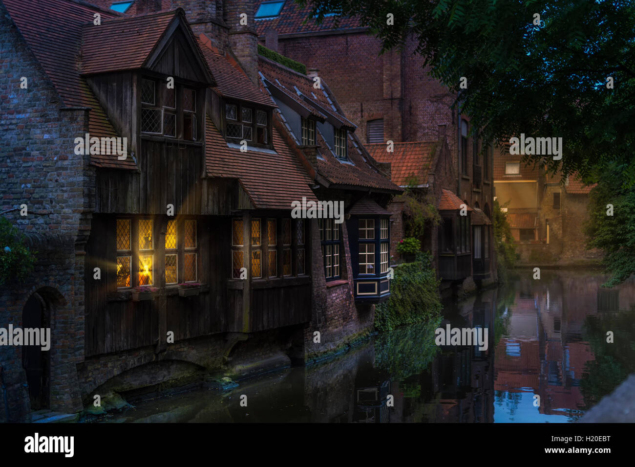 Belgium, Flanders, Bruges, Canal and old houses in the evening Stock ...