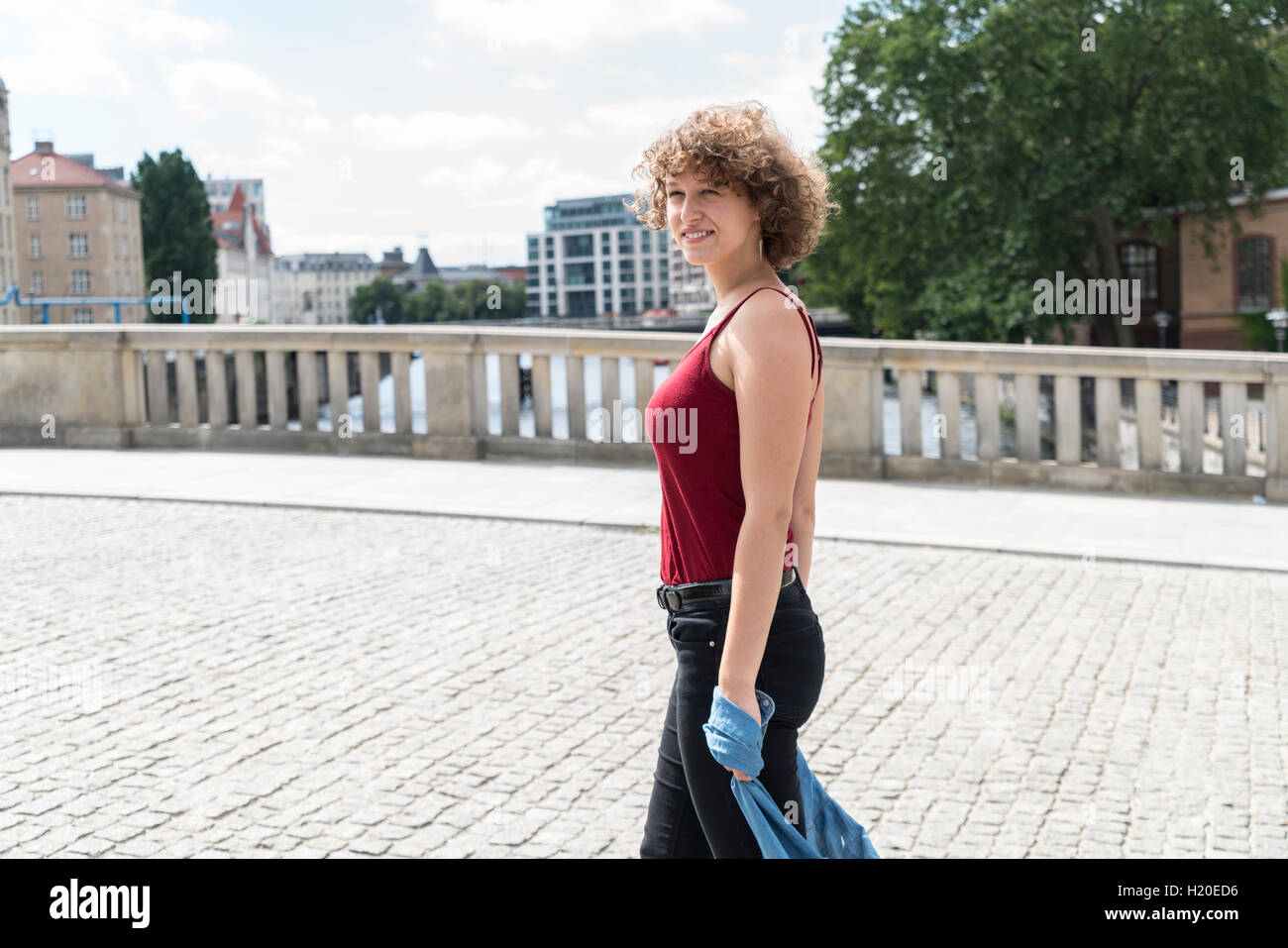 Germany, Berlin, portrait of smiling young woman Stock Photo - Alamy