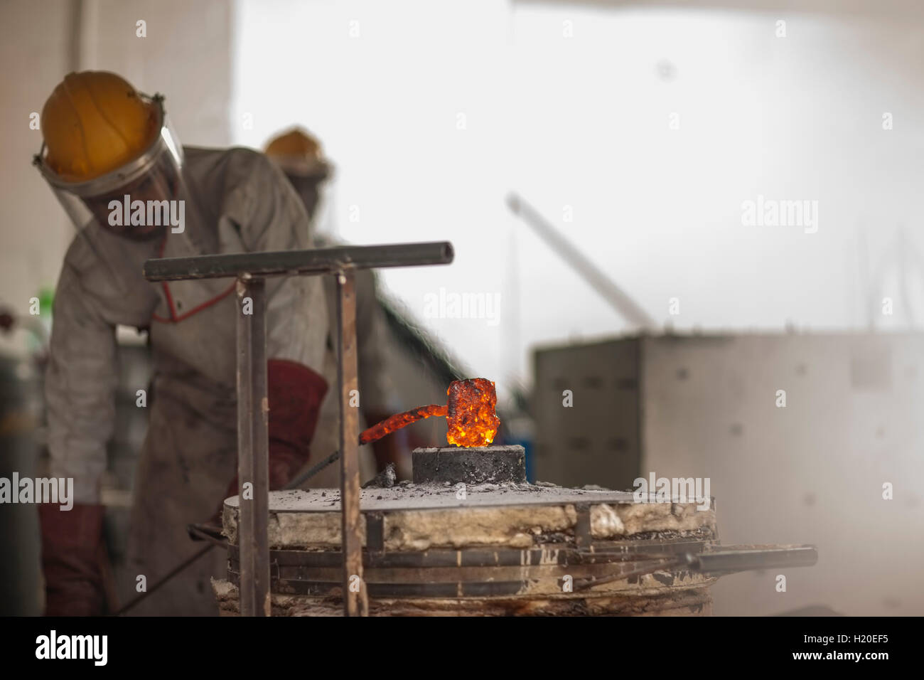 Men forging iron hi-res stock photography and images - Alamy