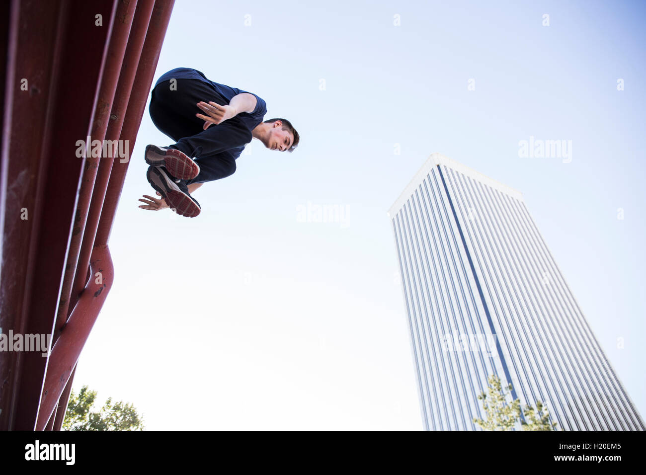 Man jumping over fence in city hi-res stock photography and images - Alamy