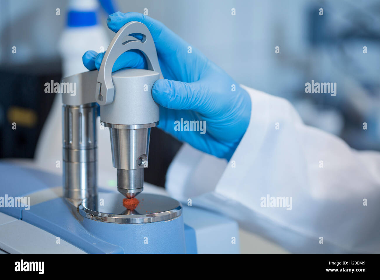 Examination of powder in lab Stock Photo - Alamy