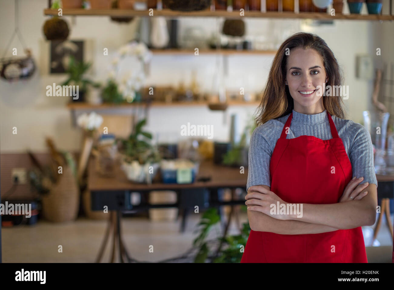 Portrait of a young florist in her shop Stock Photo - Alamy