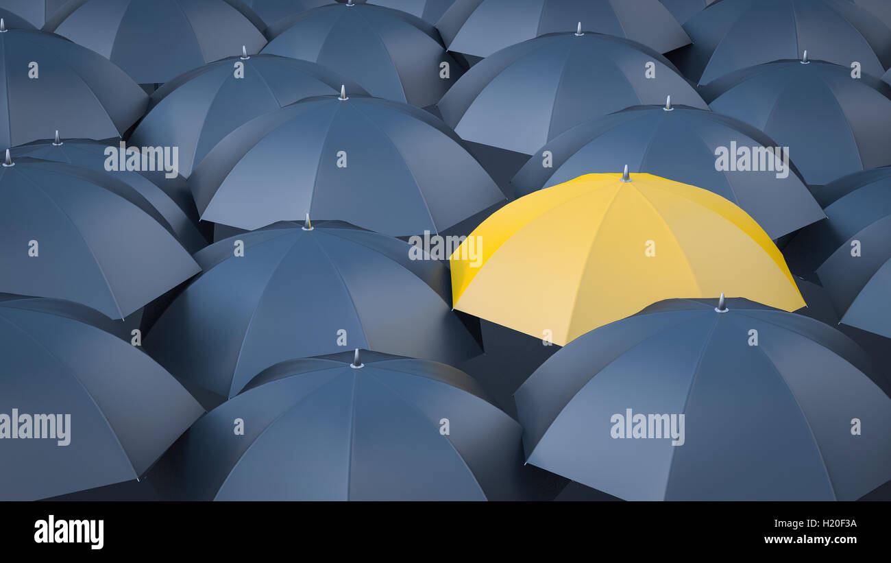 Yellow umbrella in between many black umbrellas Stock Photo - Alamy