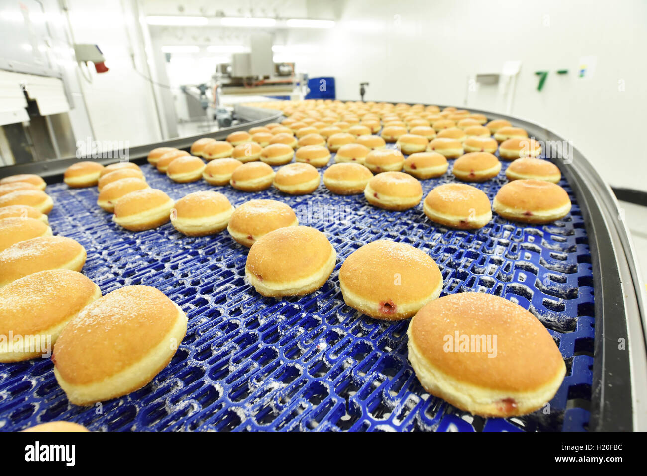 Production line in a baking factory with Berliners Stock Photo - Alamy