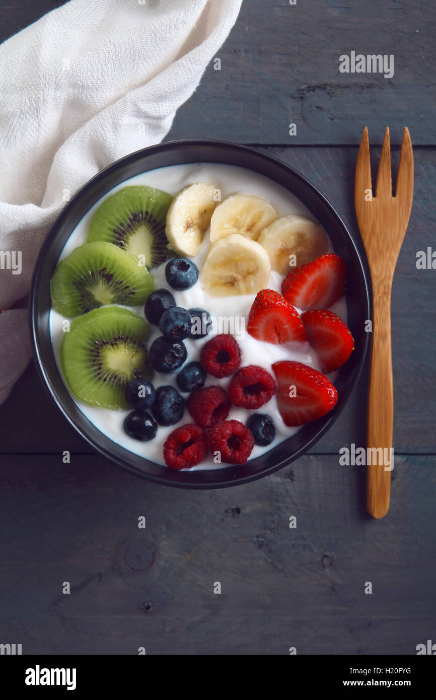 Bowl of natural yoghurt and different fresh fruits Stock Photo - Alamy