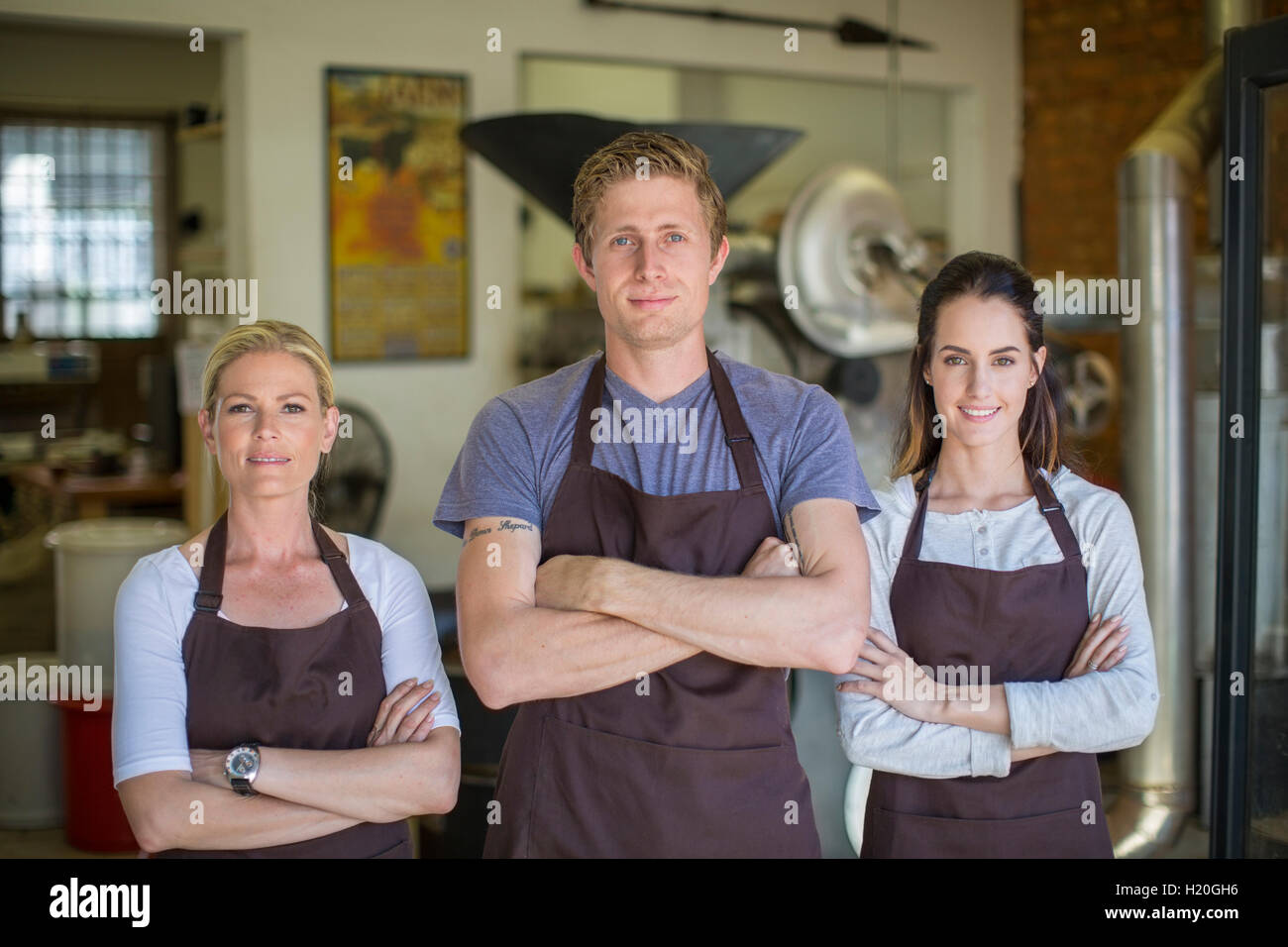 Coffee roasting shop staff in front of shop Stock Photo - Alamy