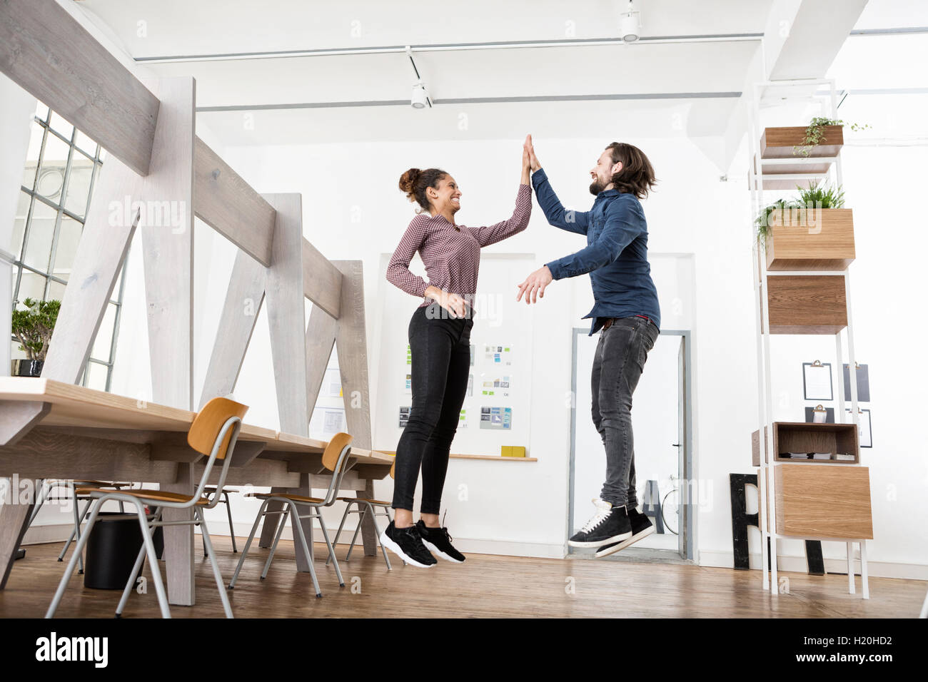 Man jumping joy office hi-res stock photography and images - Alamy