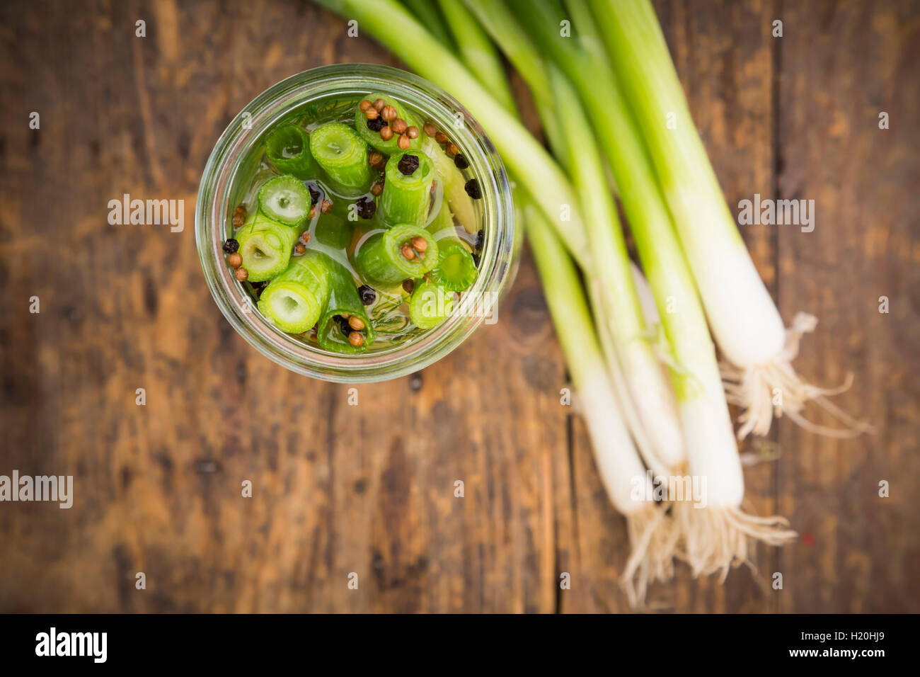 Glass of pickled spring onions Stock Photo - Alamy