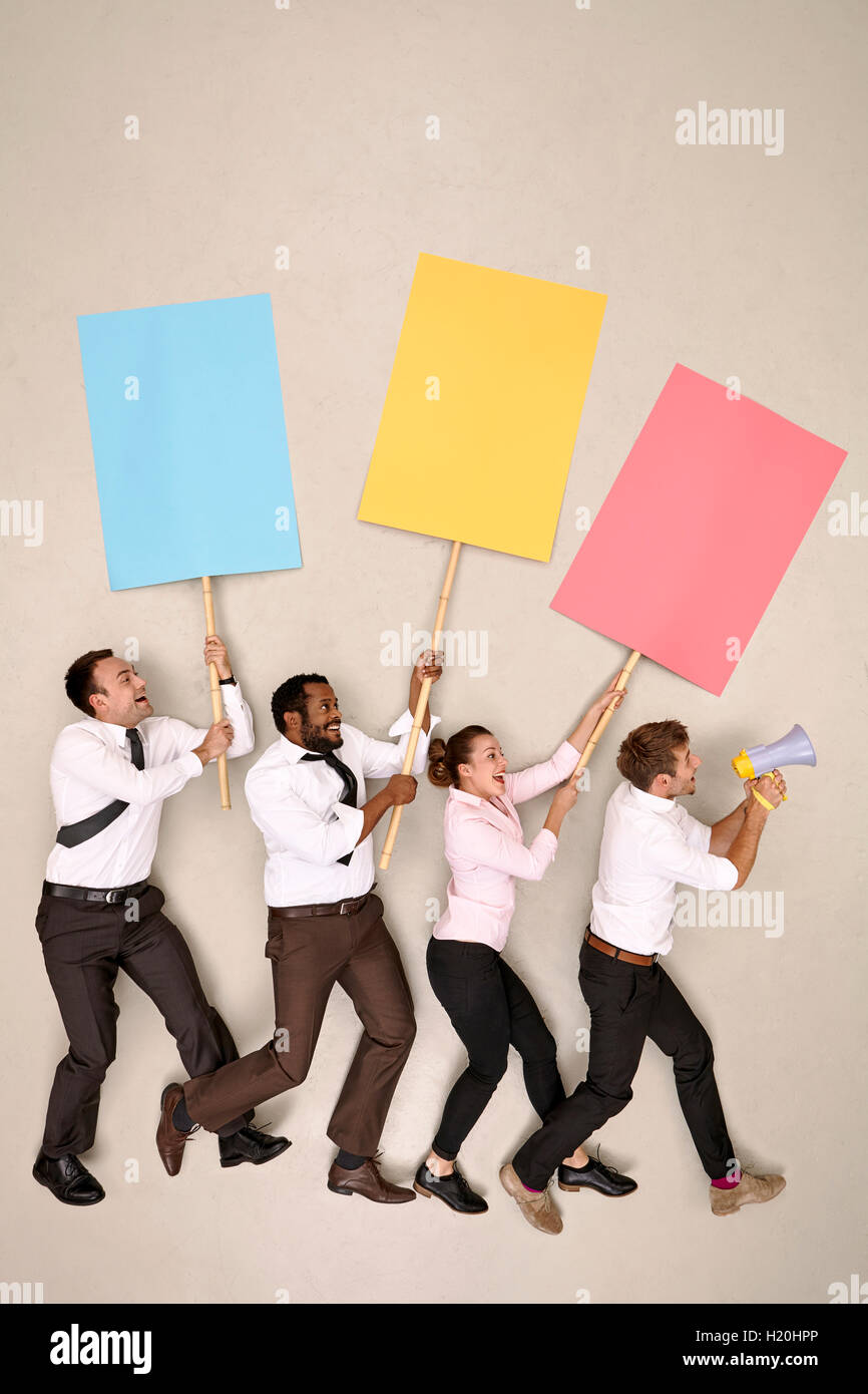 Four business colleagues demonstrating Stock Photo - Alamy
