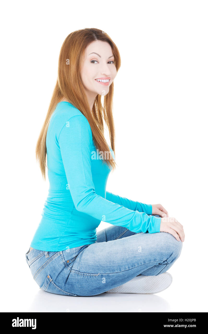 Happy attractive woman sitting Stock Photo - Alamy
