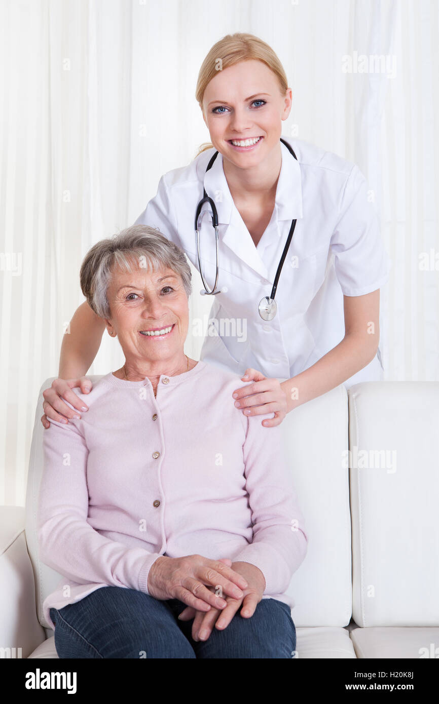 Portrait Of Doctor And Patient Sitting On Couch Stock Photo - Alamy