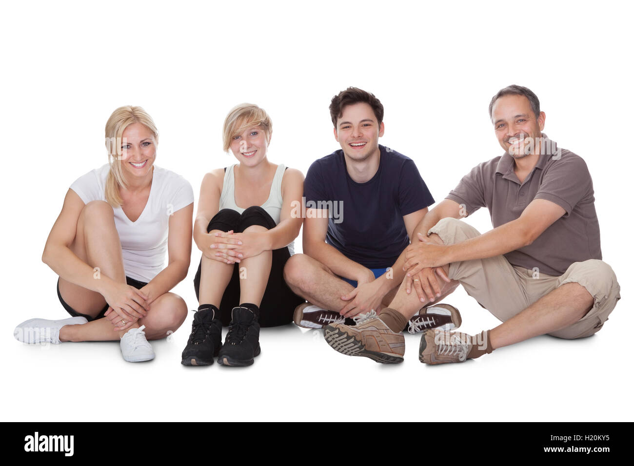 Happy friendly family relaxing Stock Photo - Alamy