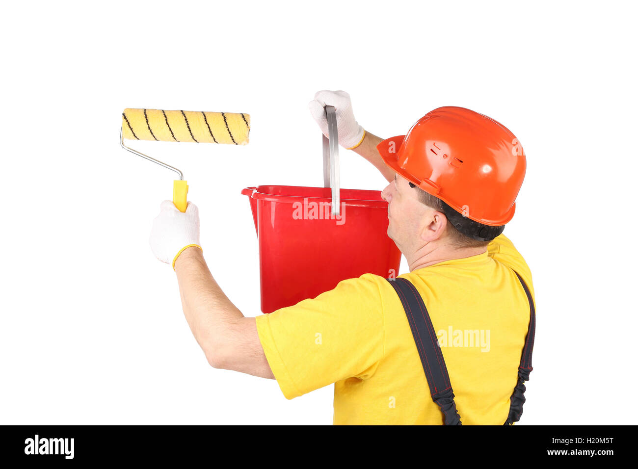 Worker with roll and bucket Stock Photo - Alamy