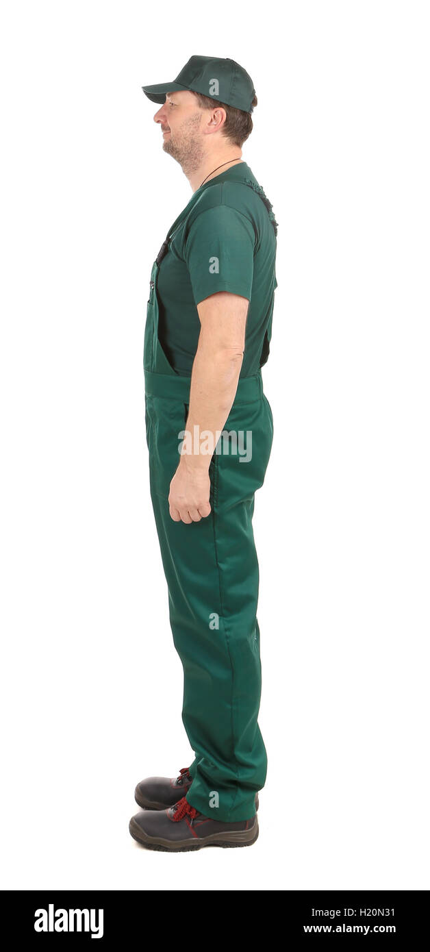 Side view. Worker in green overalls Stock Photo - Alamy
