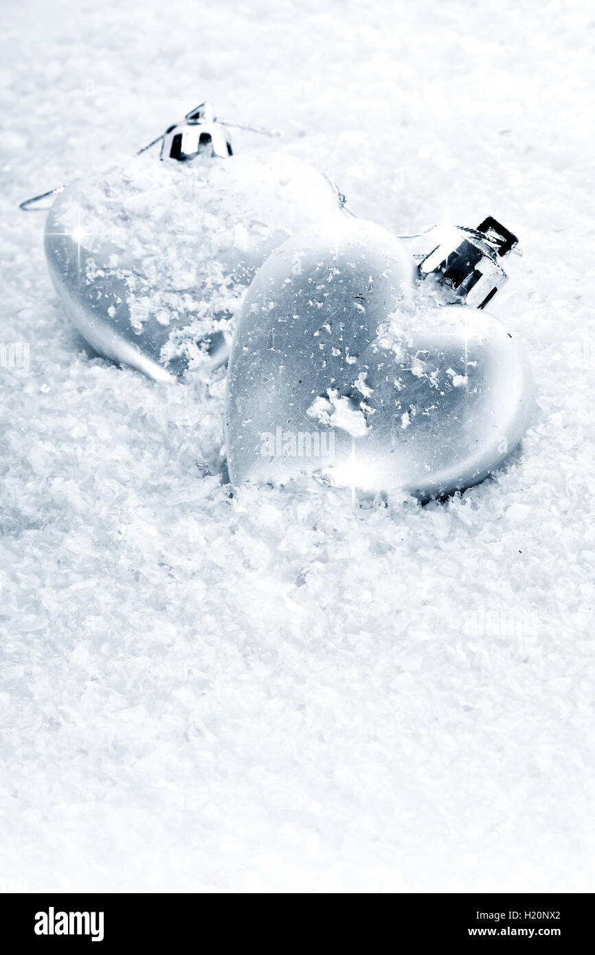 Two hearts on snow Stock Photo - Alamy