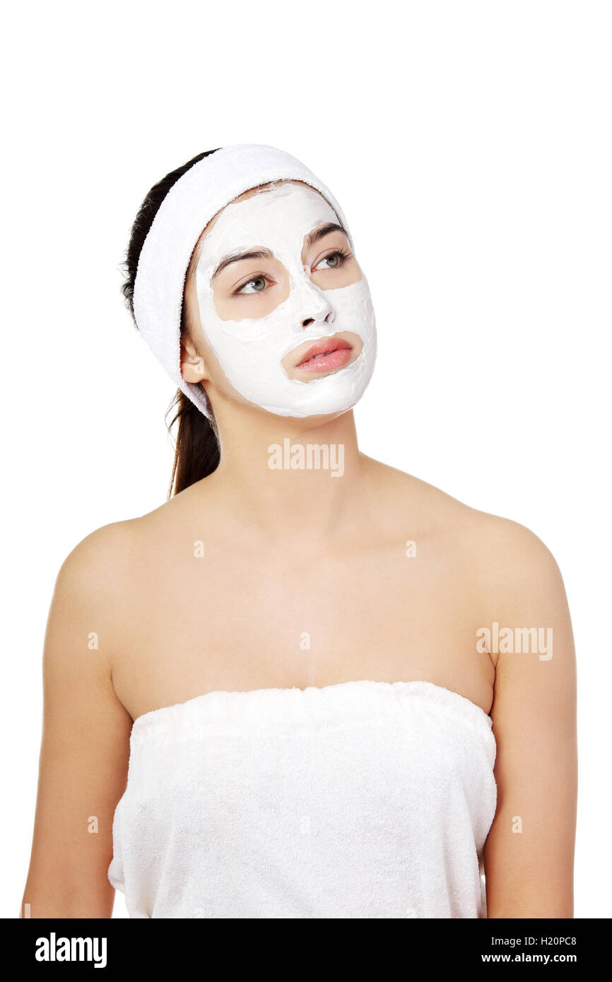 Beautiful woman with clay facial mask Stock Photo - Alamy