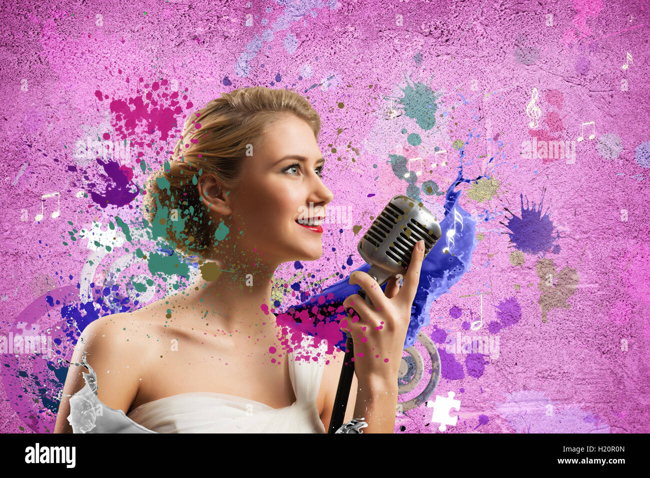 attractive female singer with microphone Stock Photo - Alamy