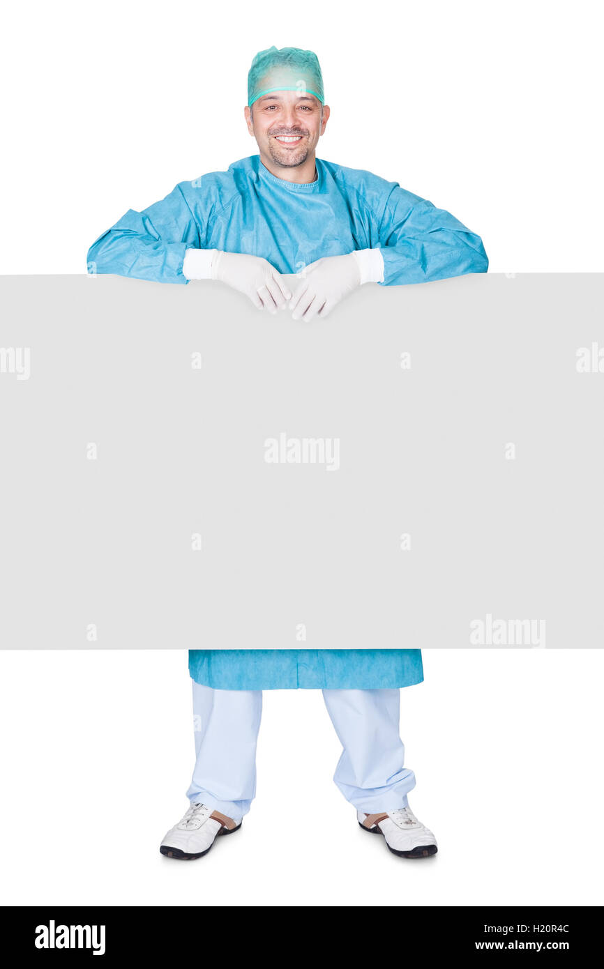 Doctor In Operation Gown Holding Blank Placard Stock Photo - Alamy