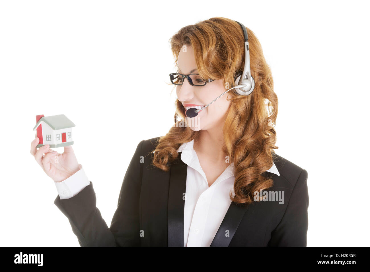 Call center assistant woman with house model Stock Photo - Alamy
