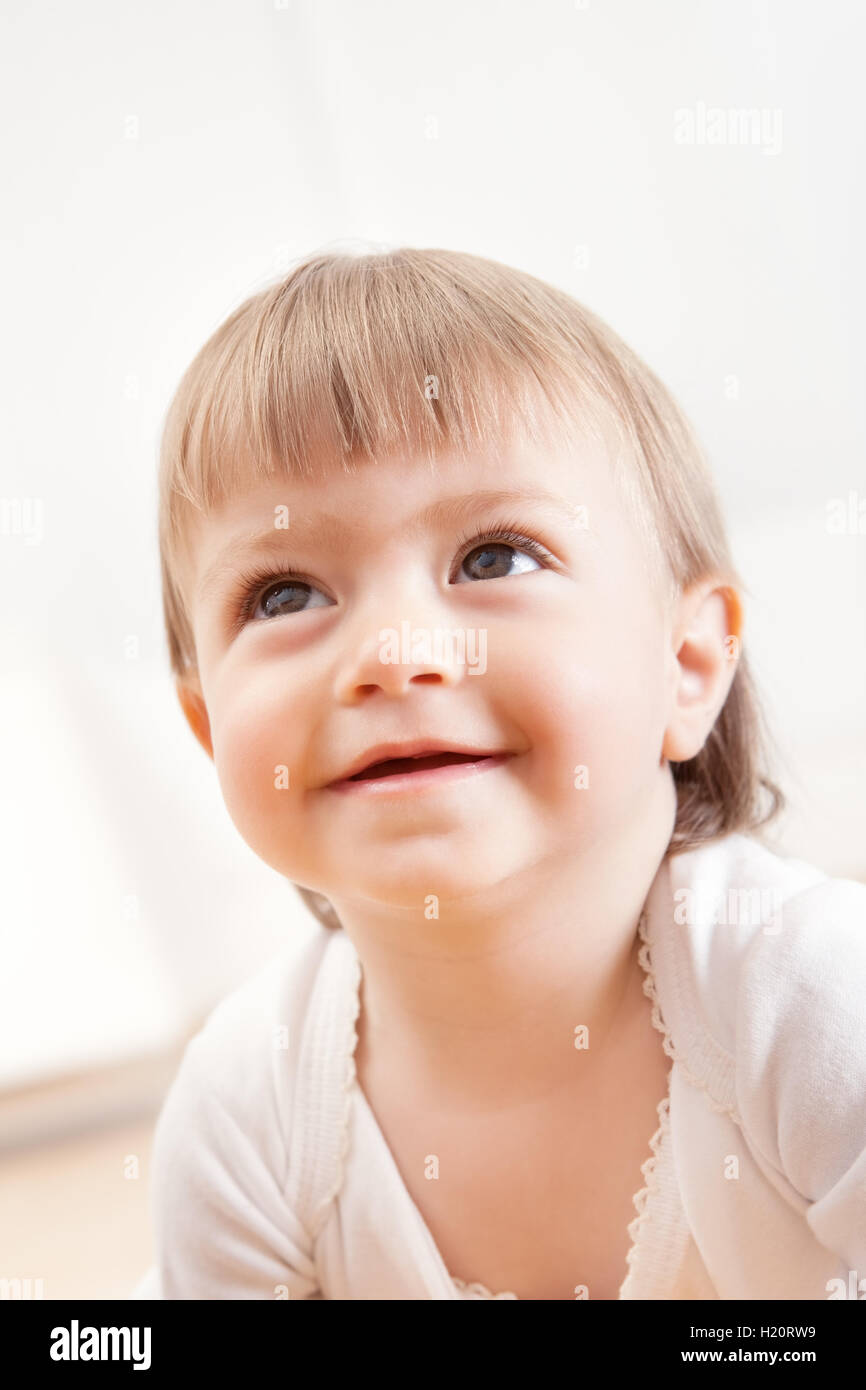 Cute innocent young baby Stock Photo - Alamy