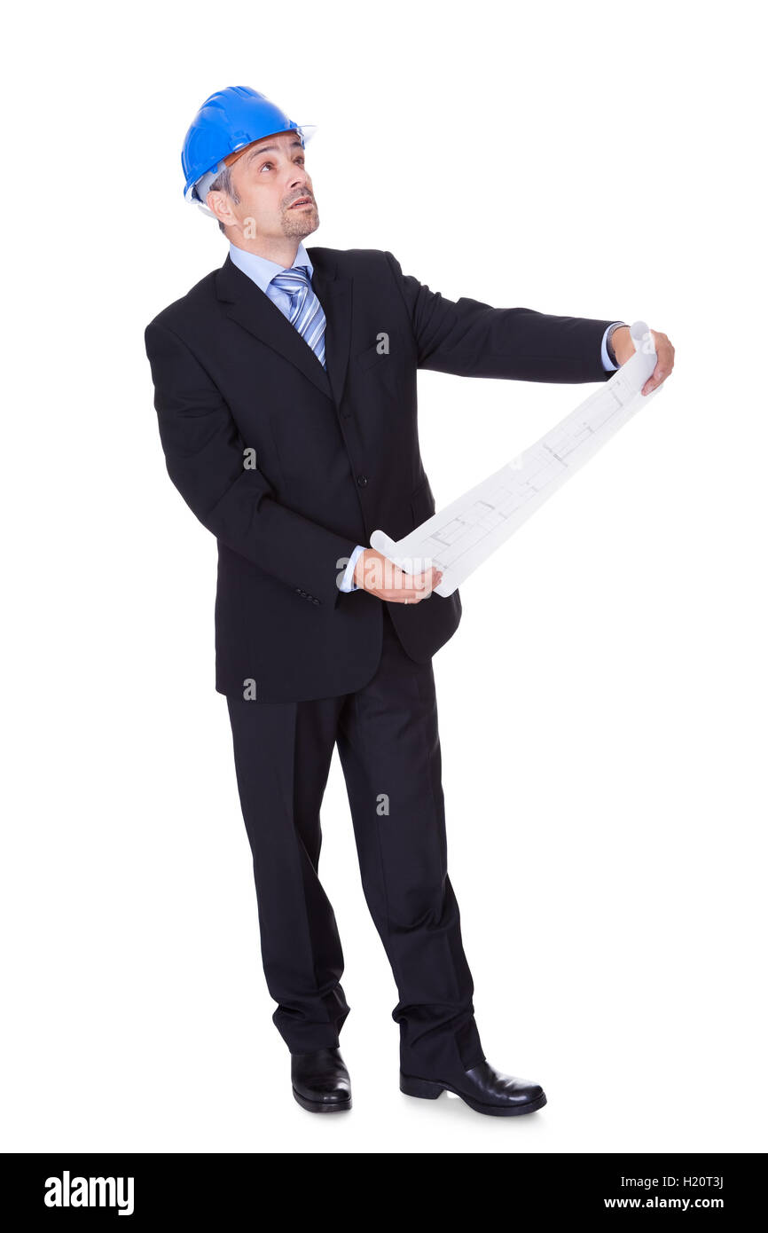 Happy Male Architect Looking At Blueprint Stock Photo - Alamy